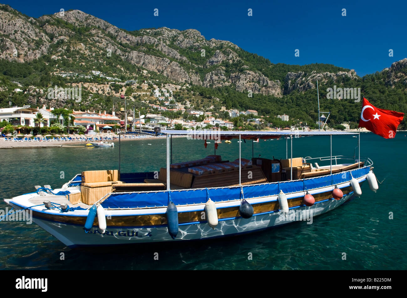 Traditional Turkish wooden taxi boat moored in the resort town of Turuc ...