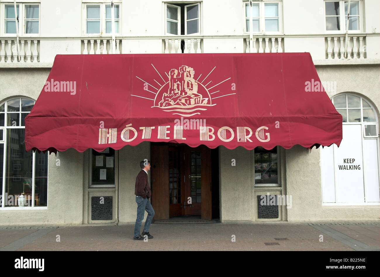 Man walking past the exterior of Hotel Borg, Reykjavik, Iceland Stock ...