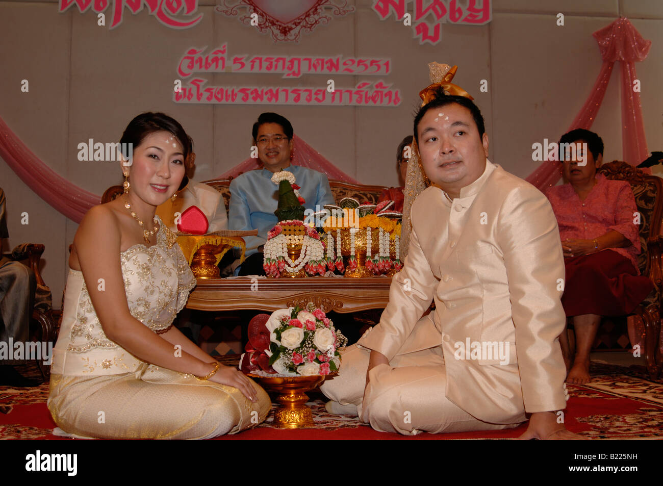 bride and groom in thai traditional dress, wedding ceremony, bangkok ...