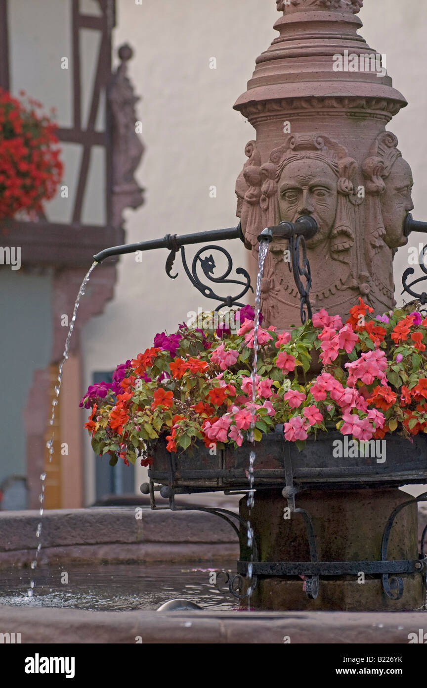 detail of a fountain decorated with flowers in old town of Miltenberg ...