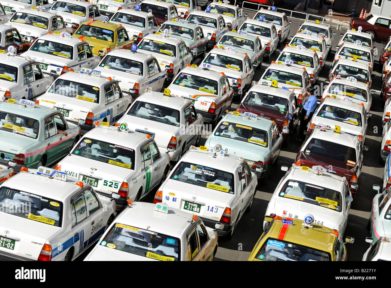 Lines of white taxi cars waiting at Sendai JR Station Japan Stock Photo ...