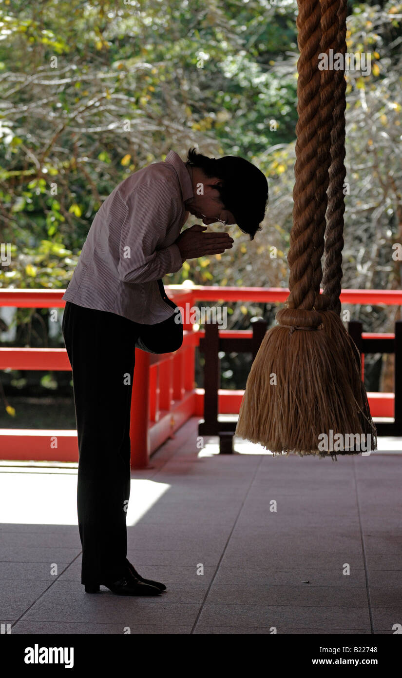 Japanese woman praying in Gokoku Shrine Sendai Japan Stock Photo - Alamy
