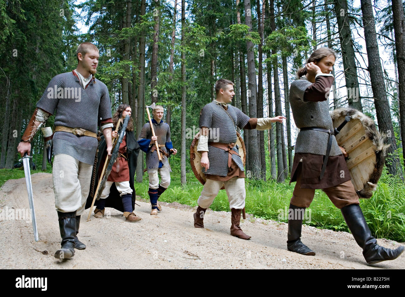 Medieval soldiers walking through the forest Stock Photo - Alamy