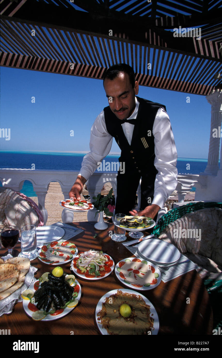 Waiter serving meal Felfella Egyptian restaurant Hurghada Eqypt Stock ...
