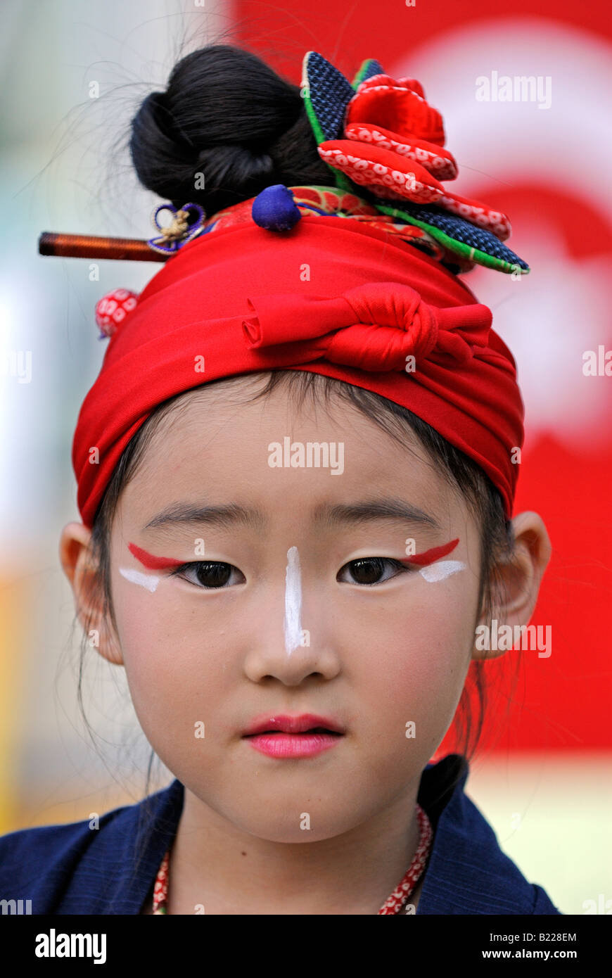 Little Japanese girl with painted face at Michinoku YOSAKOI Festival ...