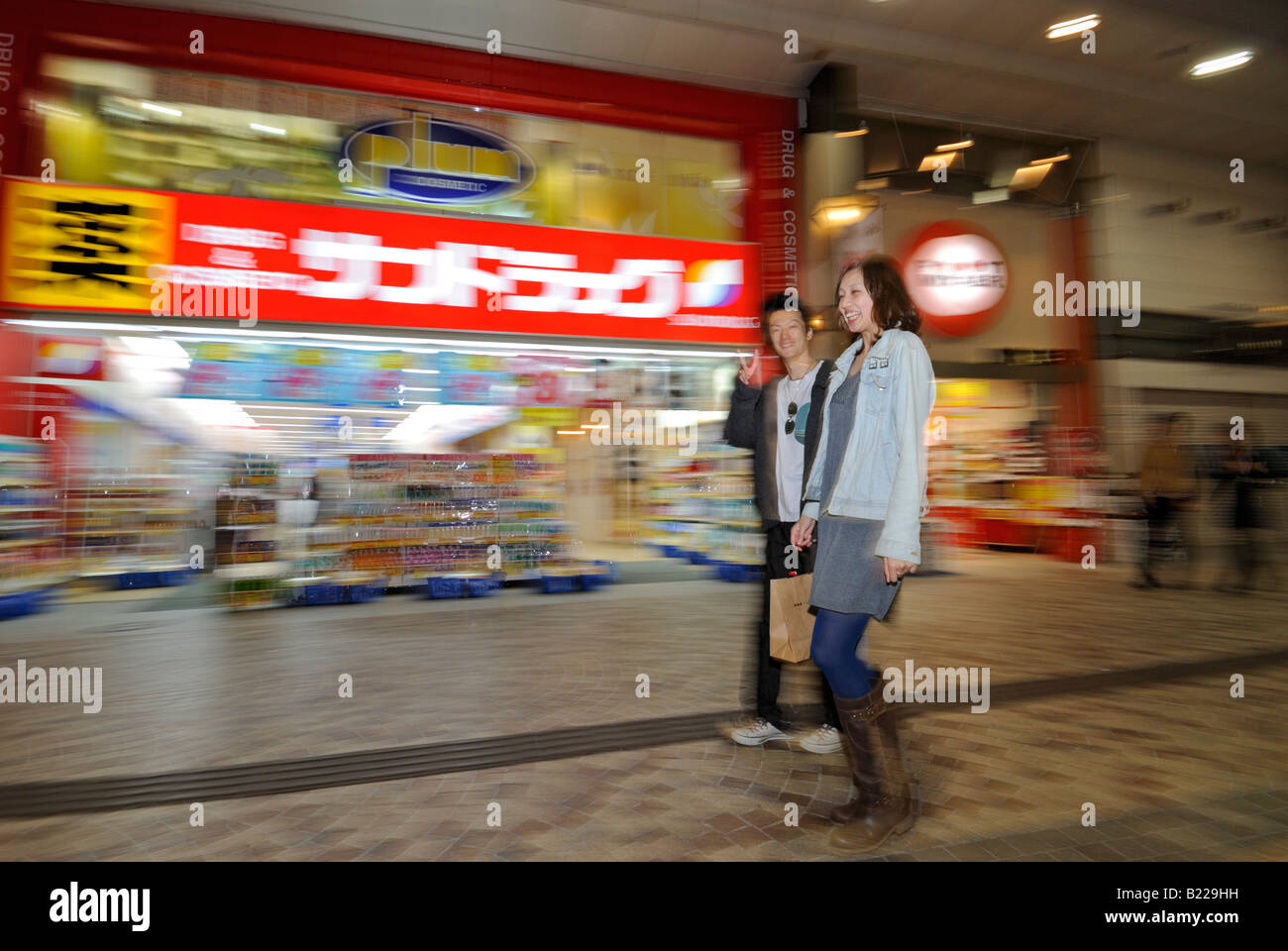 Japanese couple walking on street at night Sendai Japan Stock Photo - Alamy