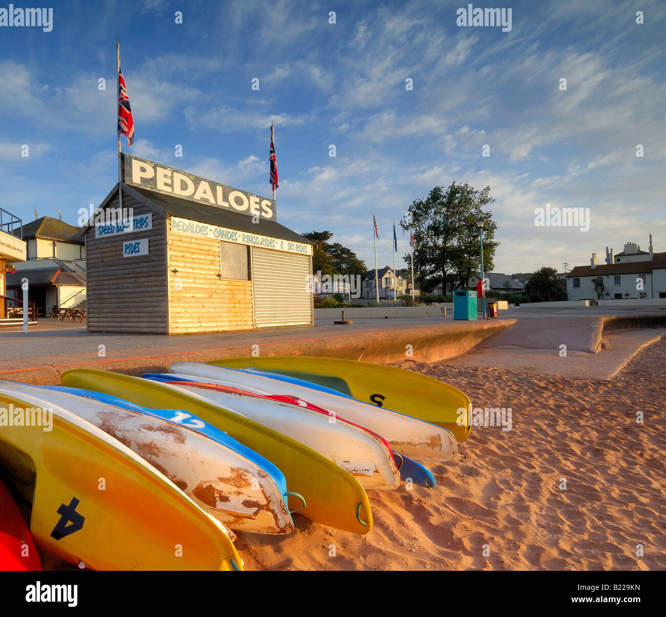 Colourful canoes in lovely dawn light on the promenade at Goodrington ...