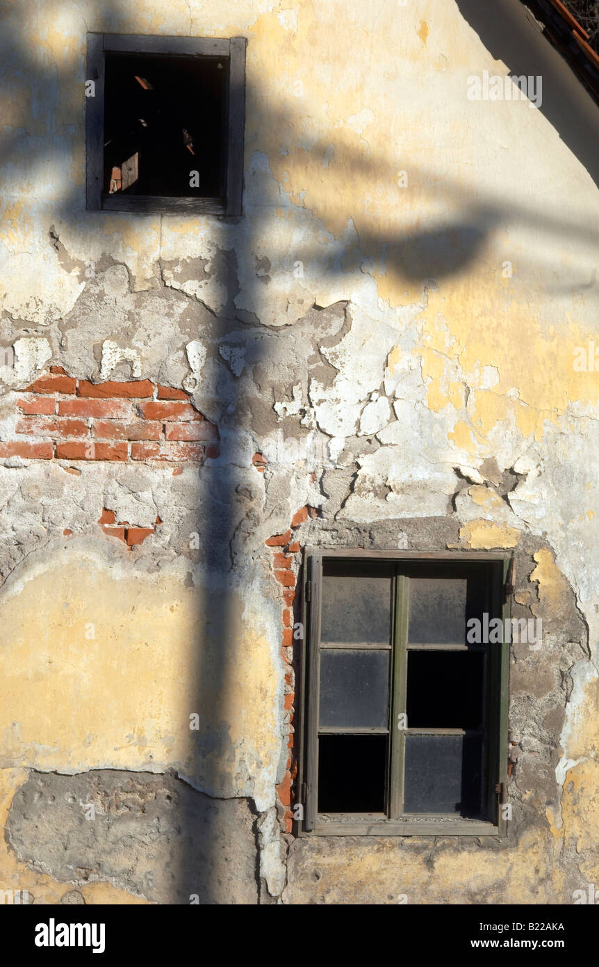 One street lamp shadow on the ruined house wall Stock Photo - Alamy