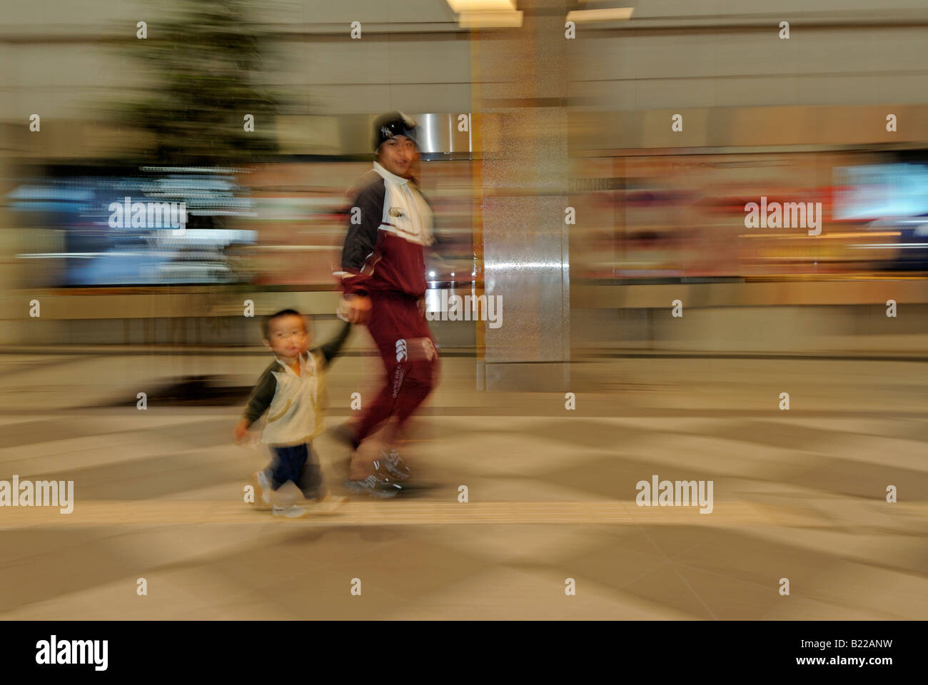 Japanese dad and boy walking on Sendai streets at night Sendai Japan ...