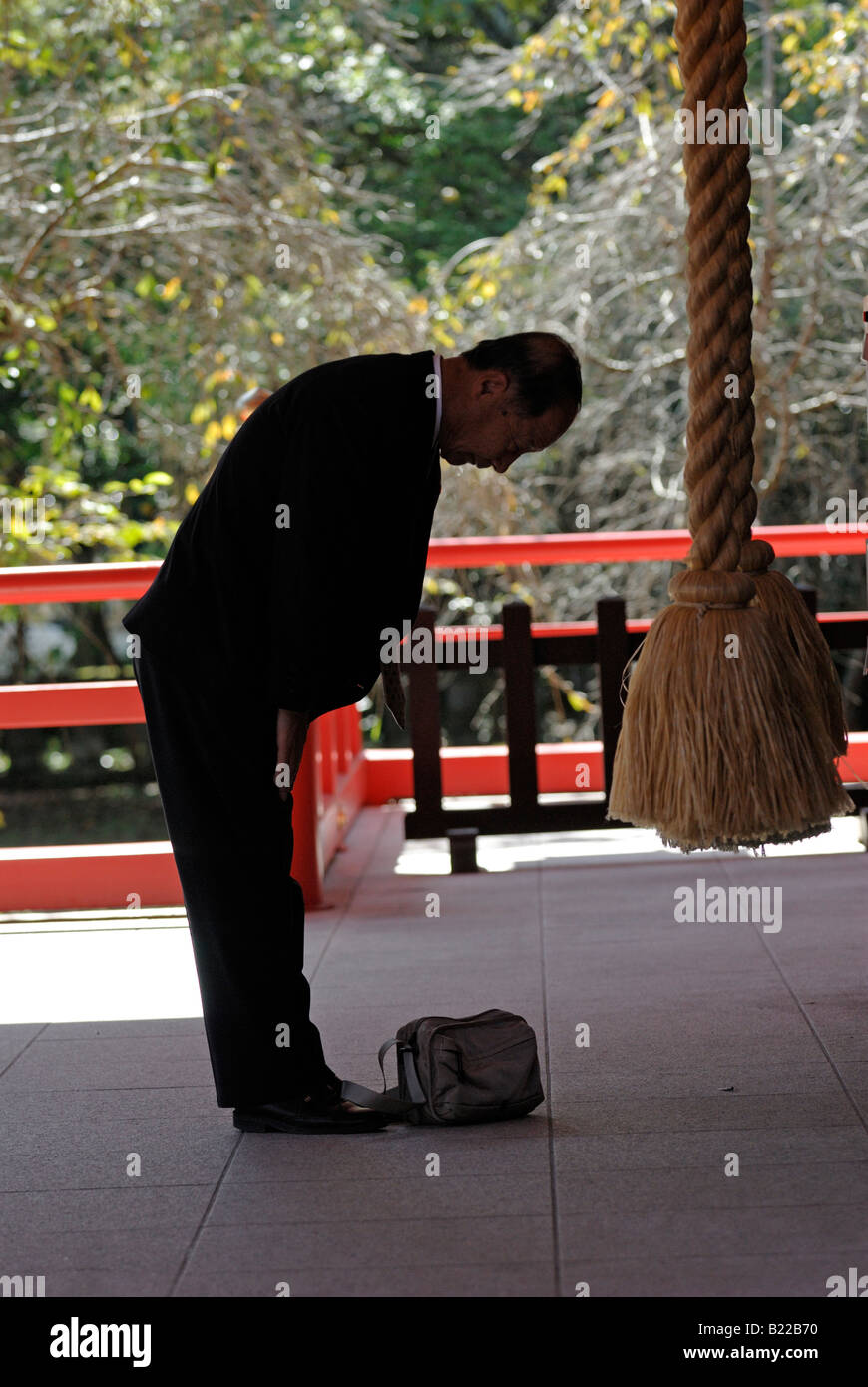 Japanese man praying in Gokoku Shrine Sendai Japan Stock Photo - Alamy