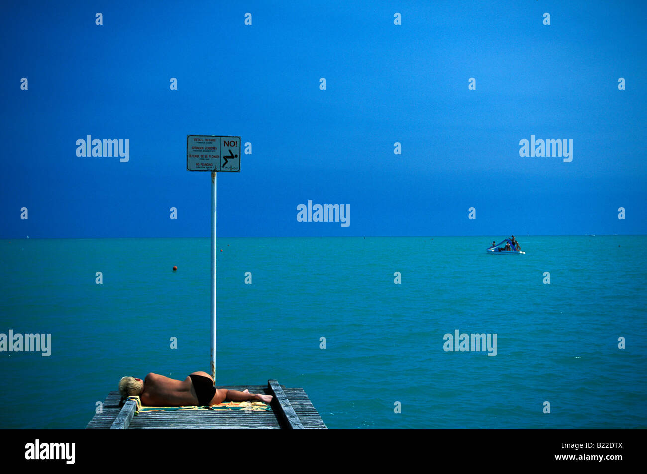 Italian woman sunbathing on beach hi-res stock photography and images ...