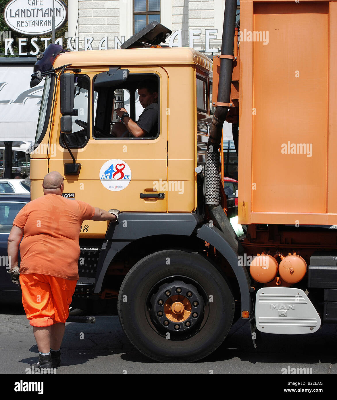 A fluorescent-orange garbed garbage collector in Vienna, Austria Stock ...