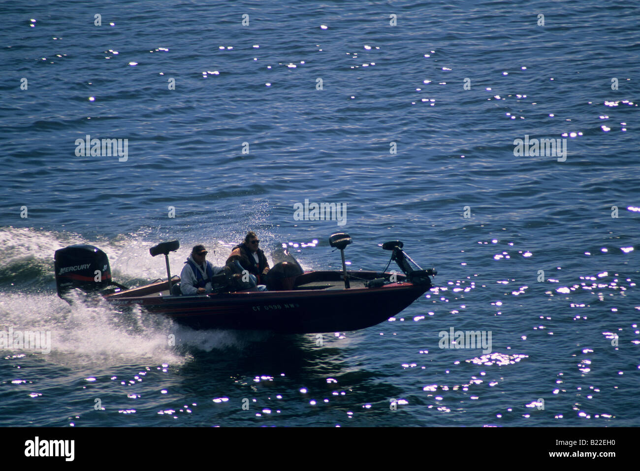Bass fishing boat speeds across Clear Lake near Lucerne Lake County ...