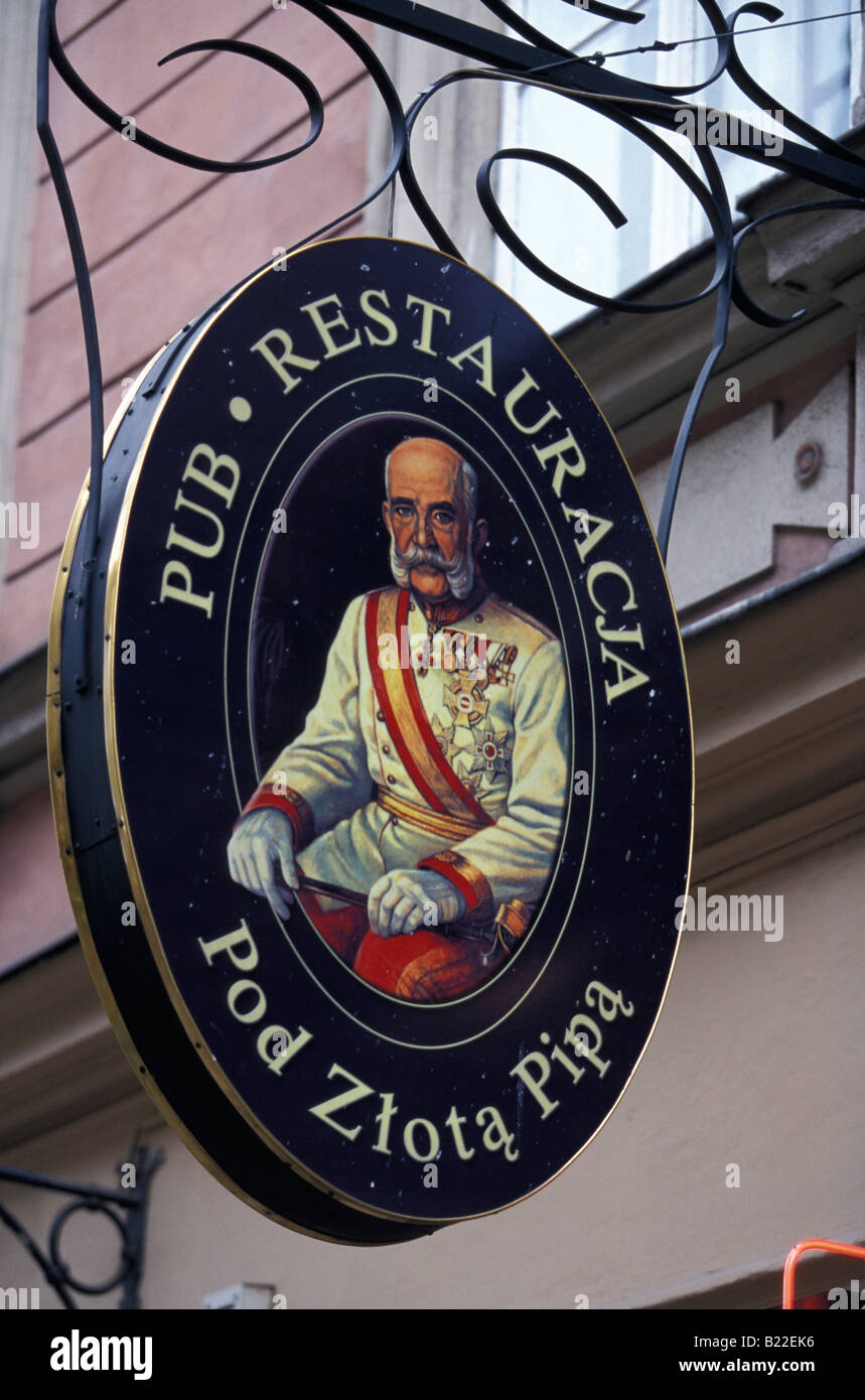 Pub sign Pod Zlota Pipa Cracow Poland Stock Photo - Alamy