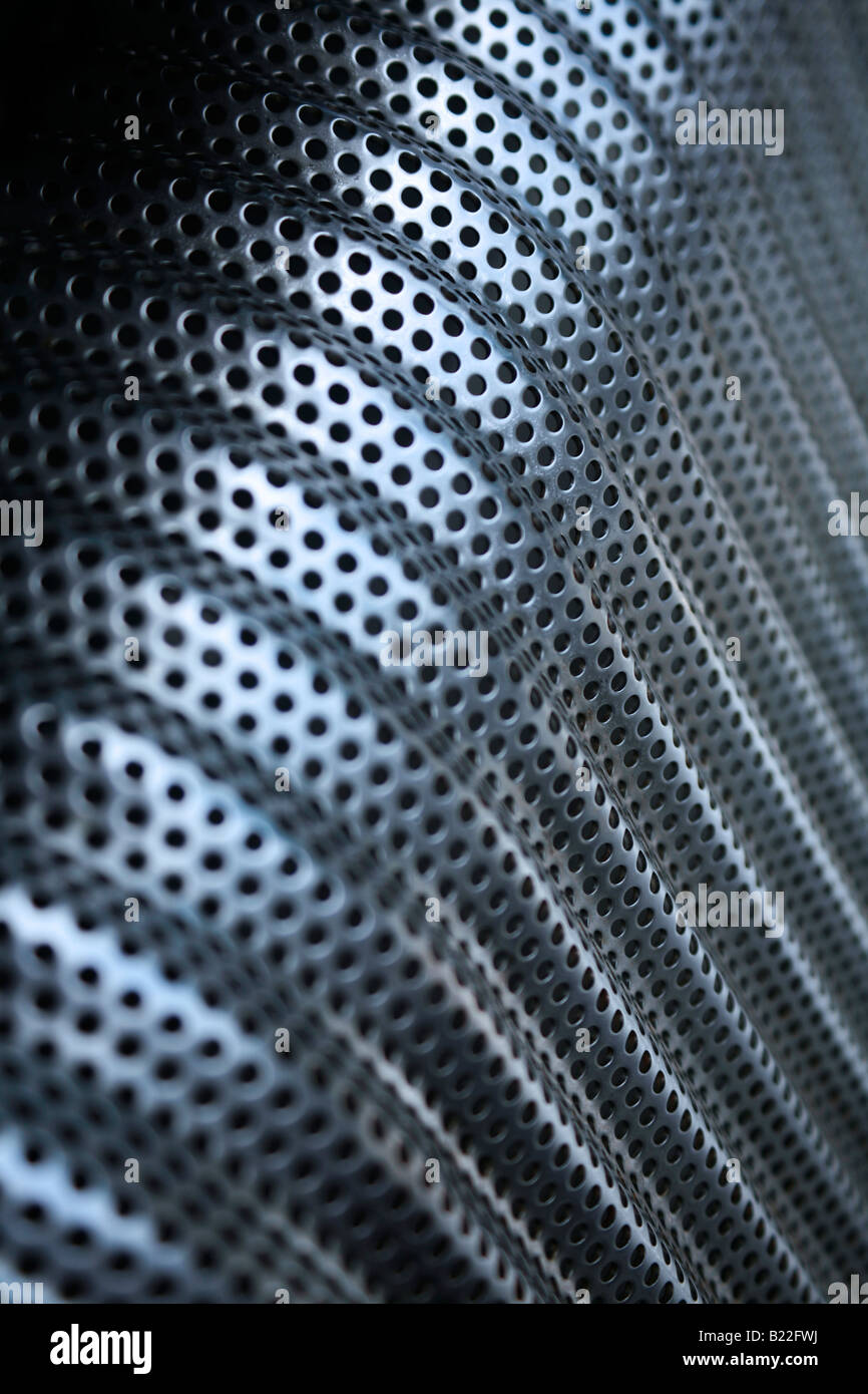 Metalic chair bench with loads of holes Stock Photo - Alamy