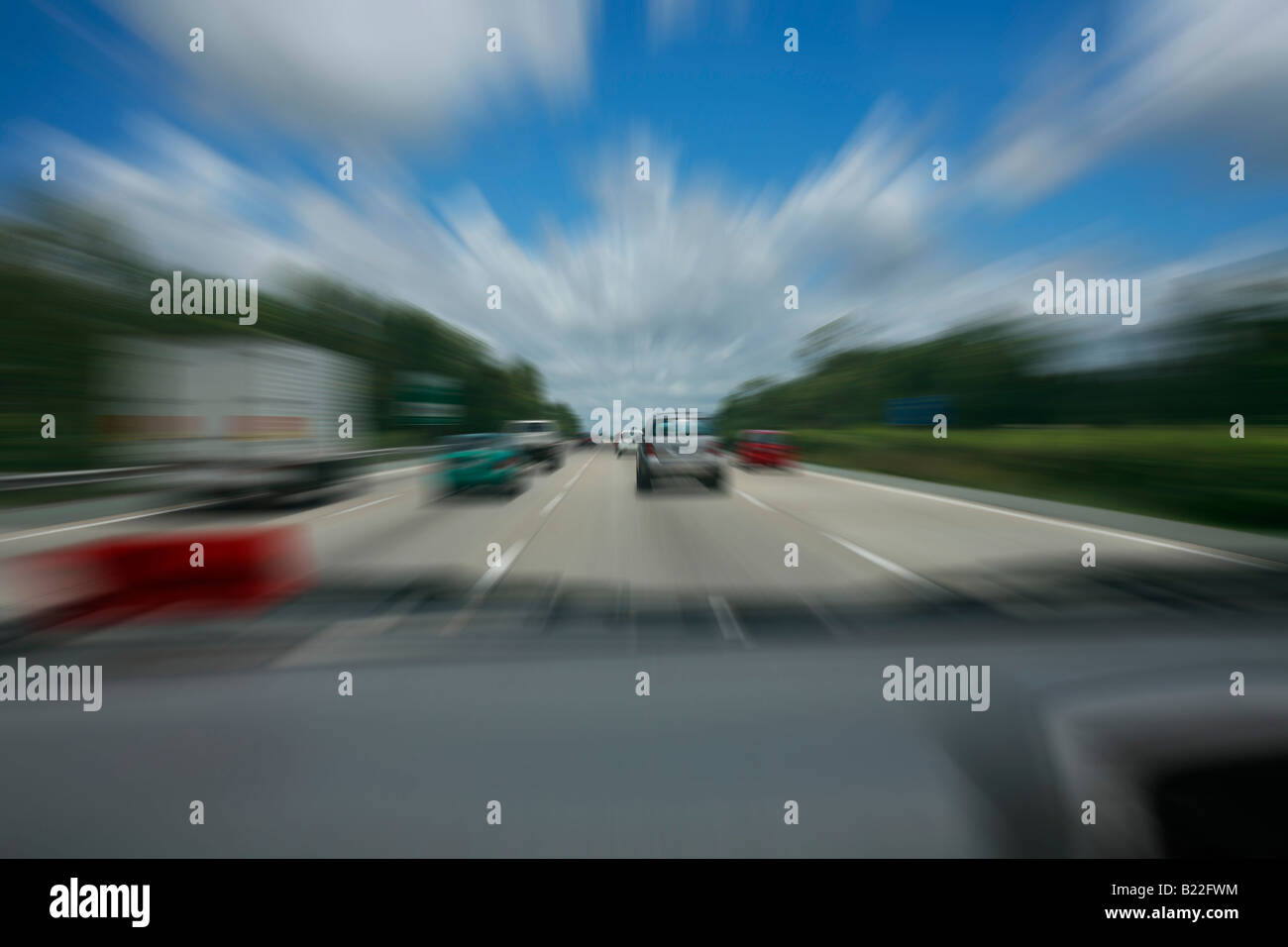 Sitting in the passenger seat driving fast in a car to the Gold Coast ...