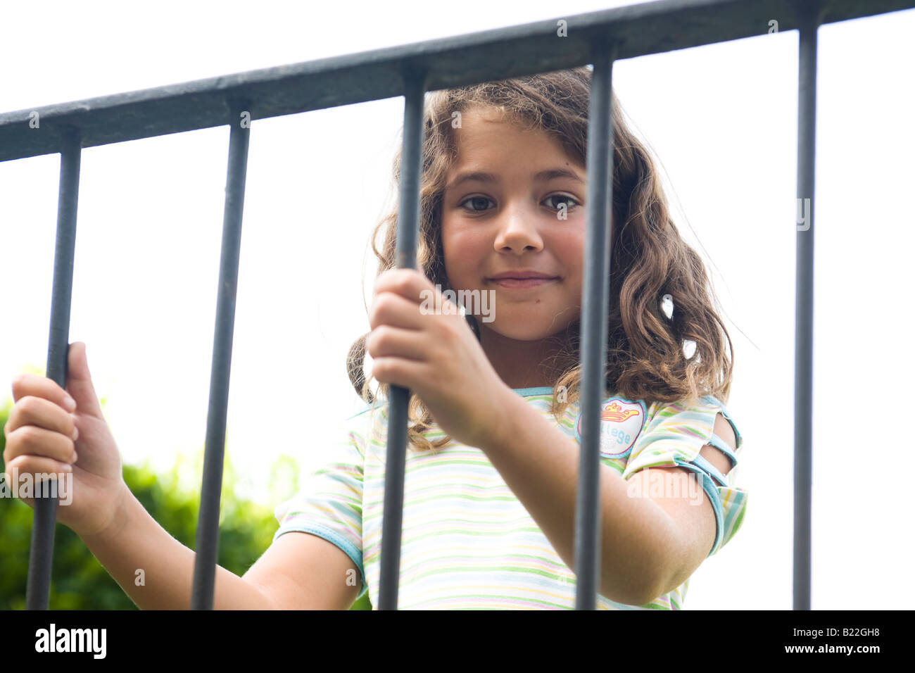 Beautiful child behind bars Stock Photo - Alamy Beautiful child behind bars Stock Photo - Alamy
