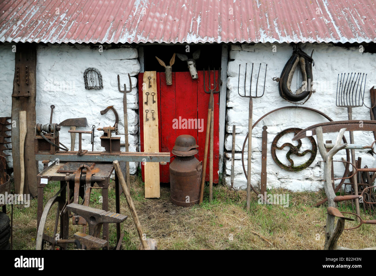 collection of decorative and functional metal work pieces implement and ...