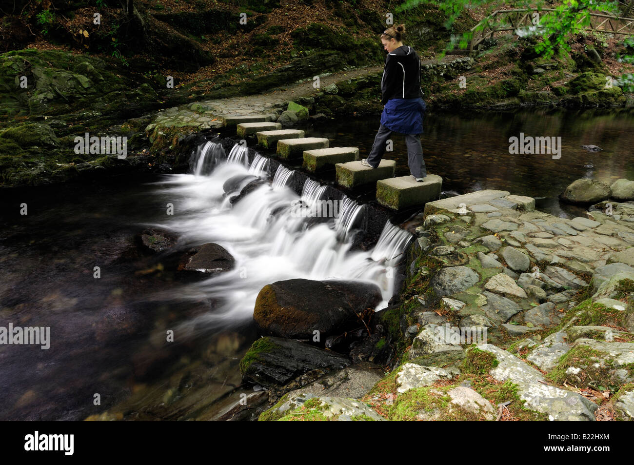 Woman walking on stepping footpath hi-res stock photography and images ...