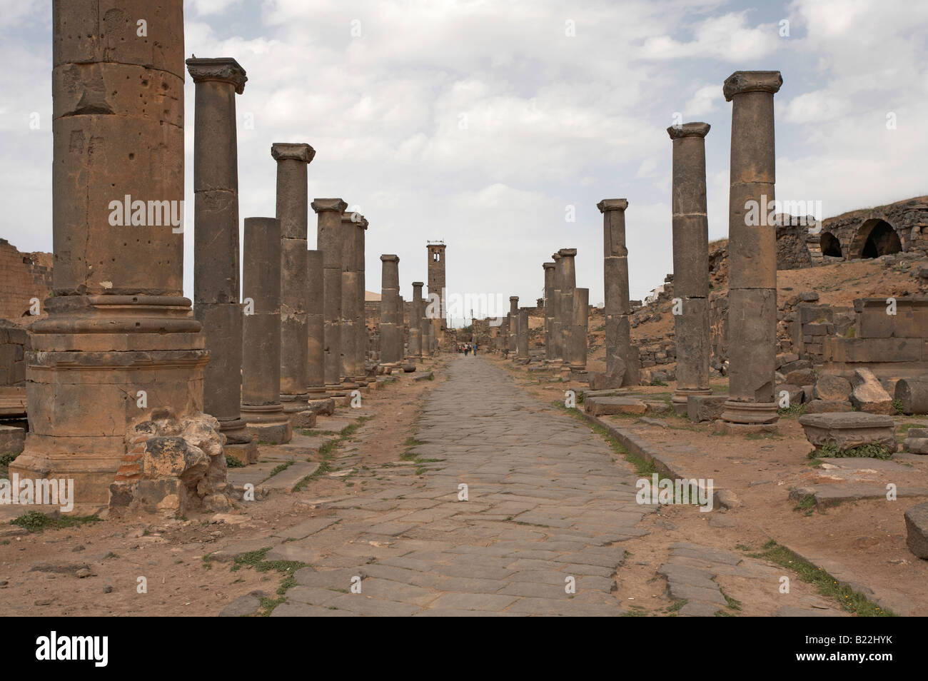 Bosra Syria roman columns and paved street Stock Photo - Alamy