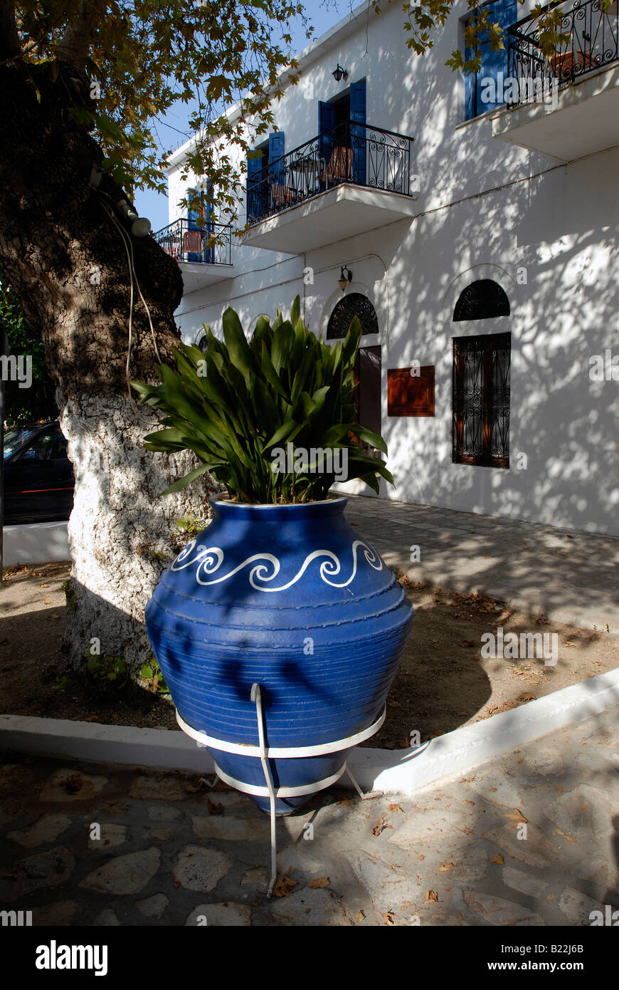 Big Amphora filled with flowers on a square of a greek village Stock ...