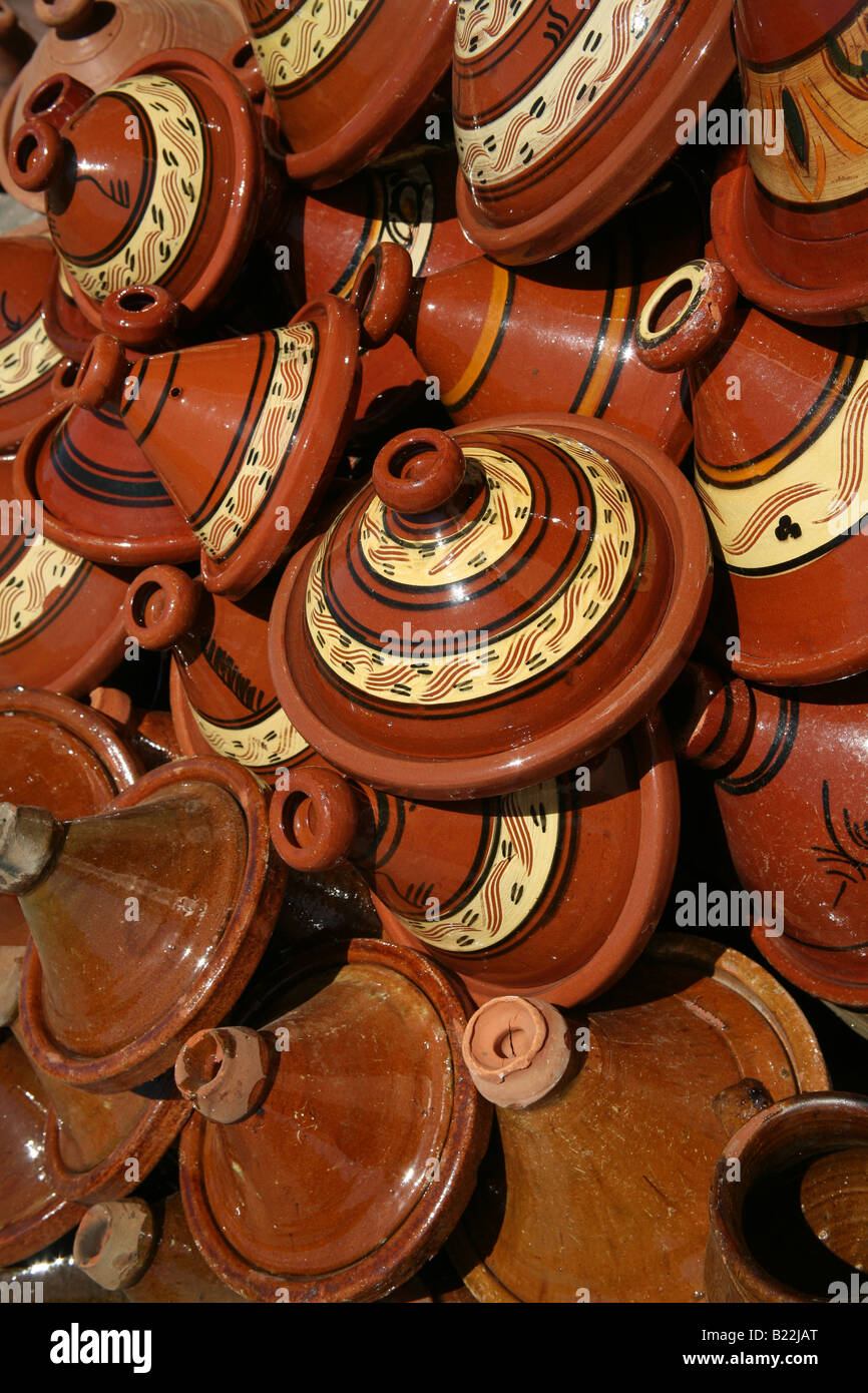 A pile of Tajine clay pots for sale in the souks in Marrakech Morocco ...