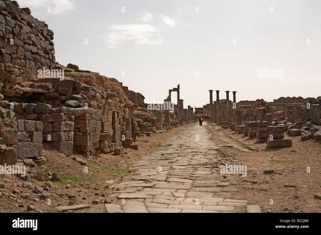 Bosra Syria roman columns and paved street Stock Photo - Alamy