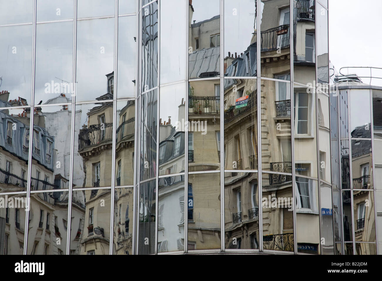 old Paris buildings reflected in modern glass tower Stock Photo - Alamy