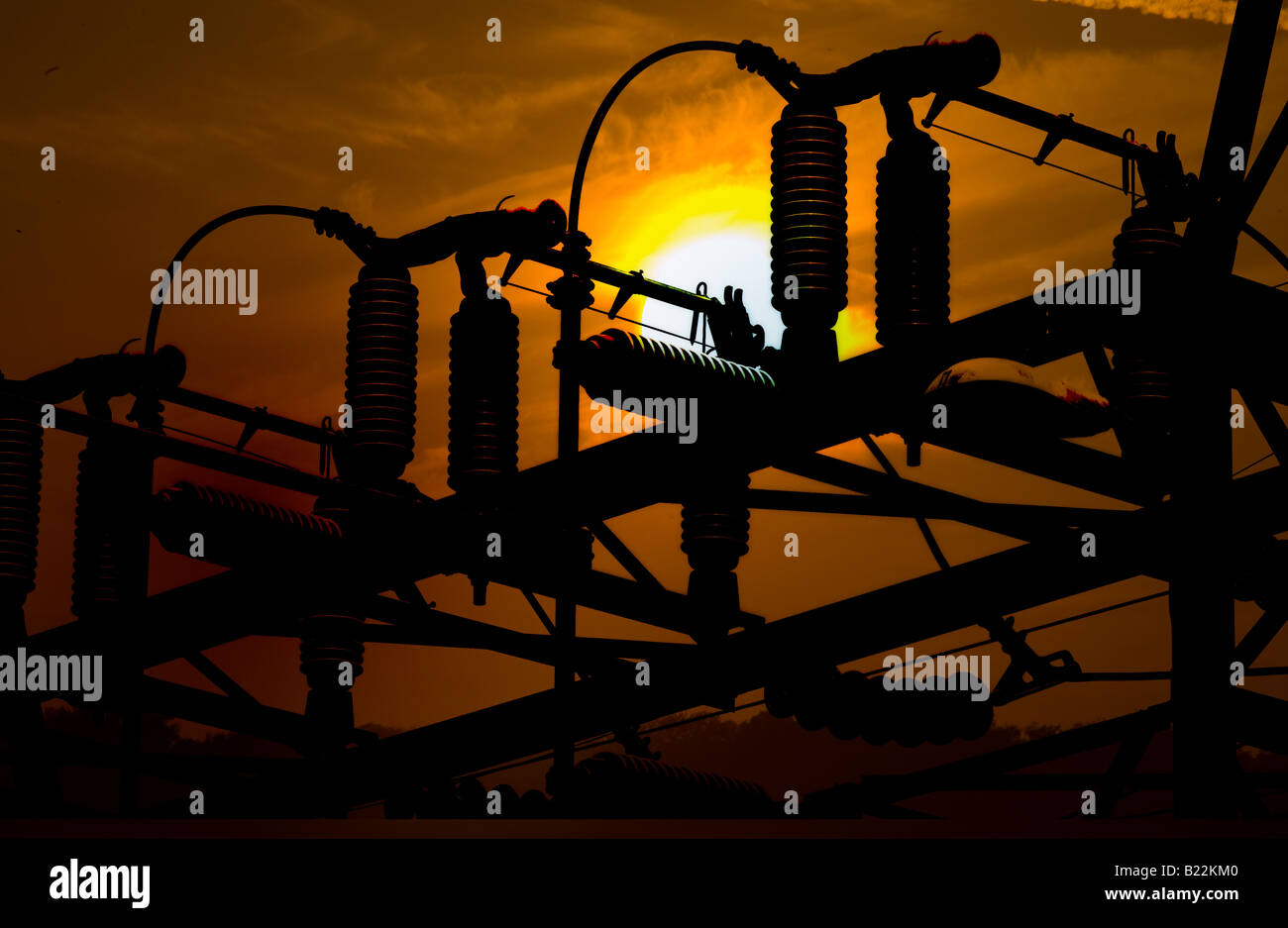 sunset over electric power station Stock Photo - Alamy