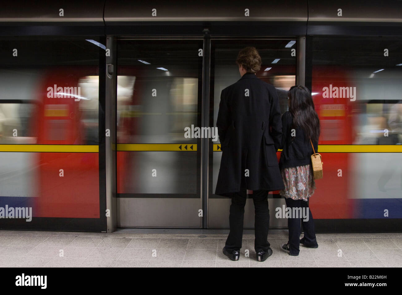 People waiting by Platform edge Doors Canada Water Underground Station ...