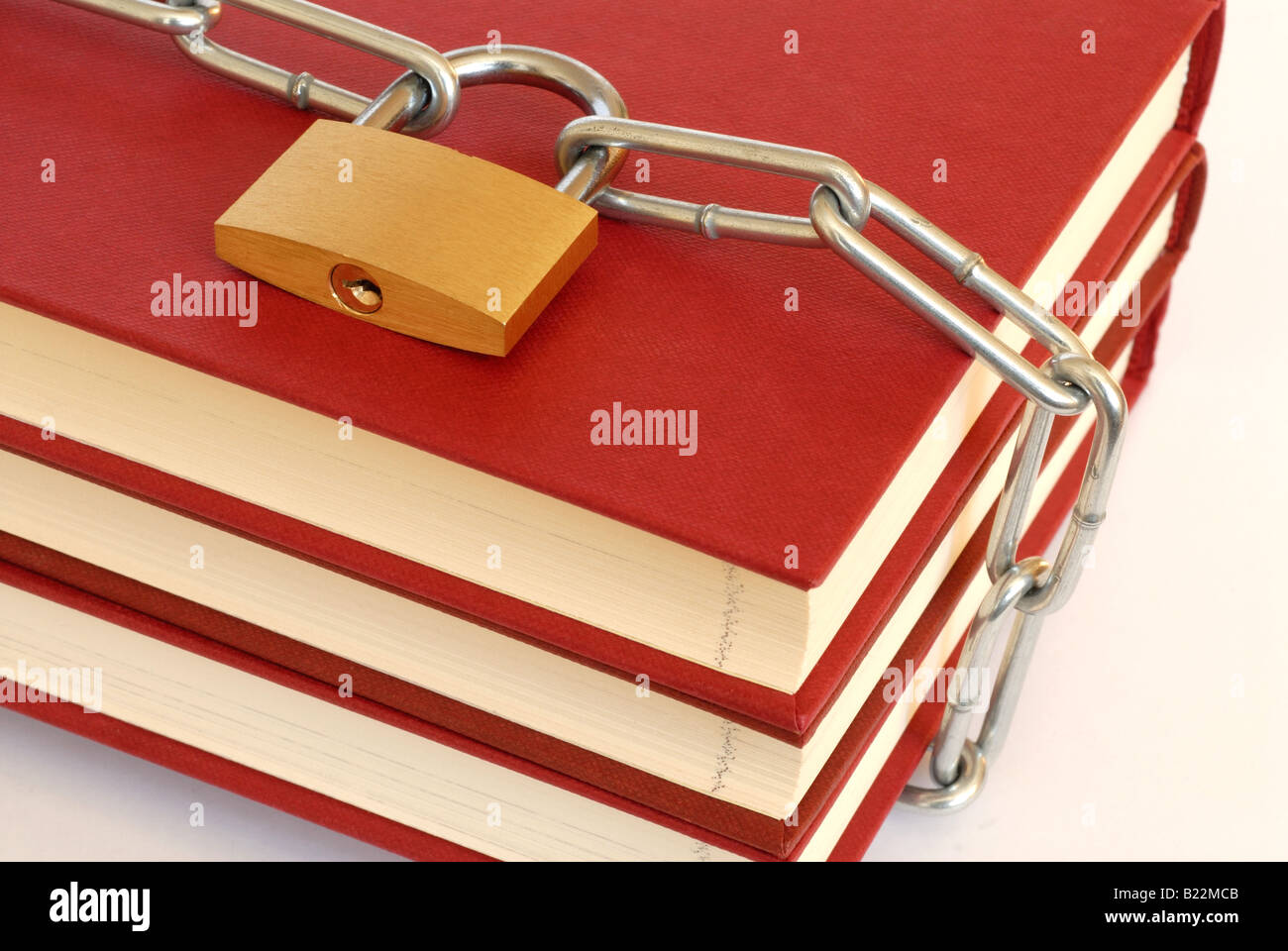 Books, chain and padlock Stock Photo - Alamy