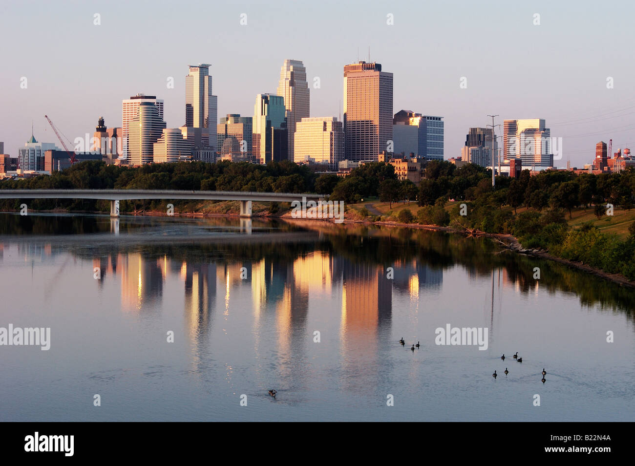 Minneapolis Minnesota skyline at dawn seen from a bridge across the ...