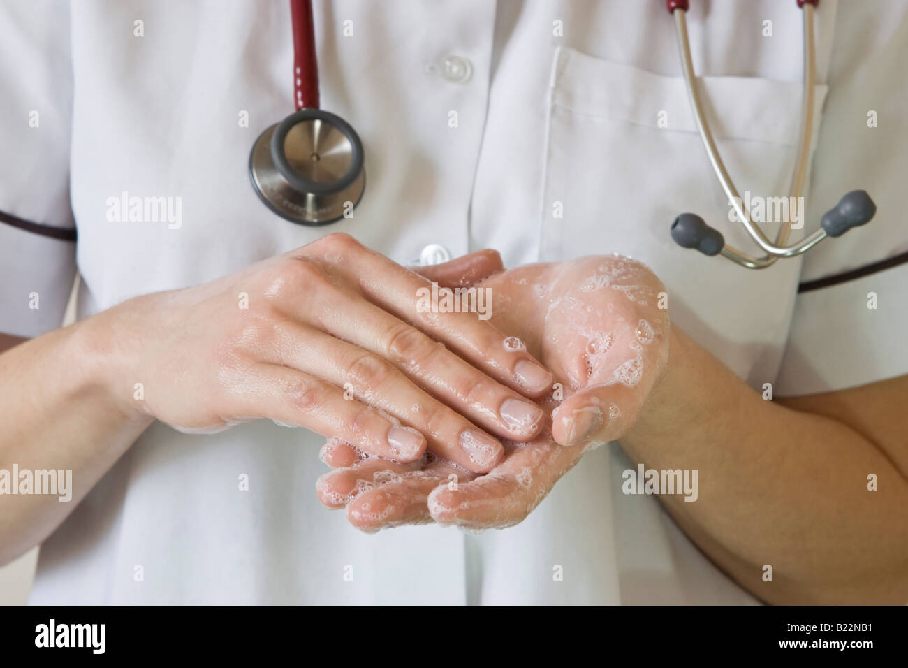 A nurse washing her hands with antibacterial soap Stock Photo - Alamy