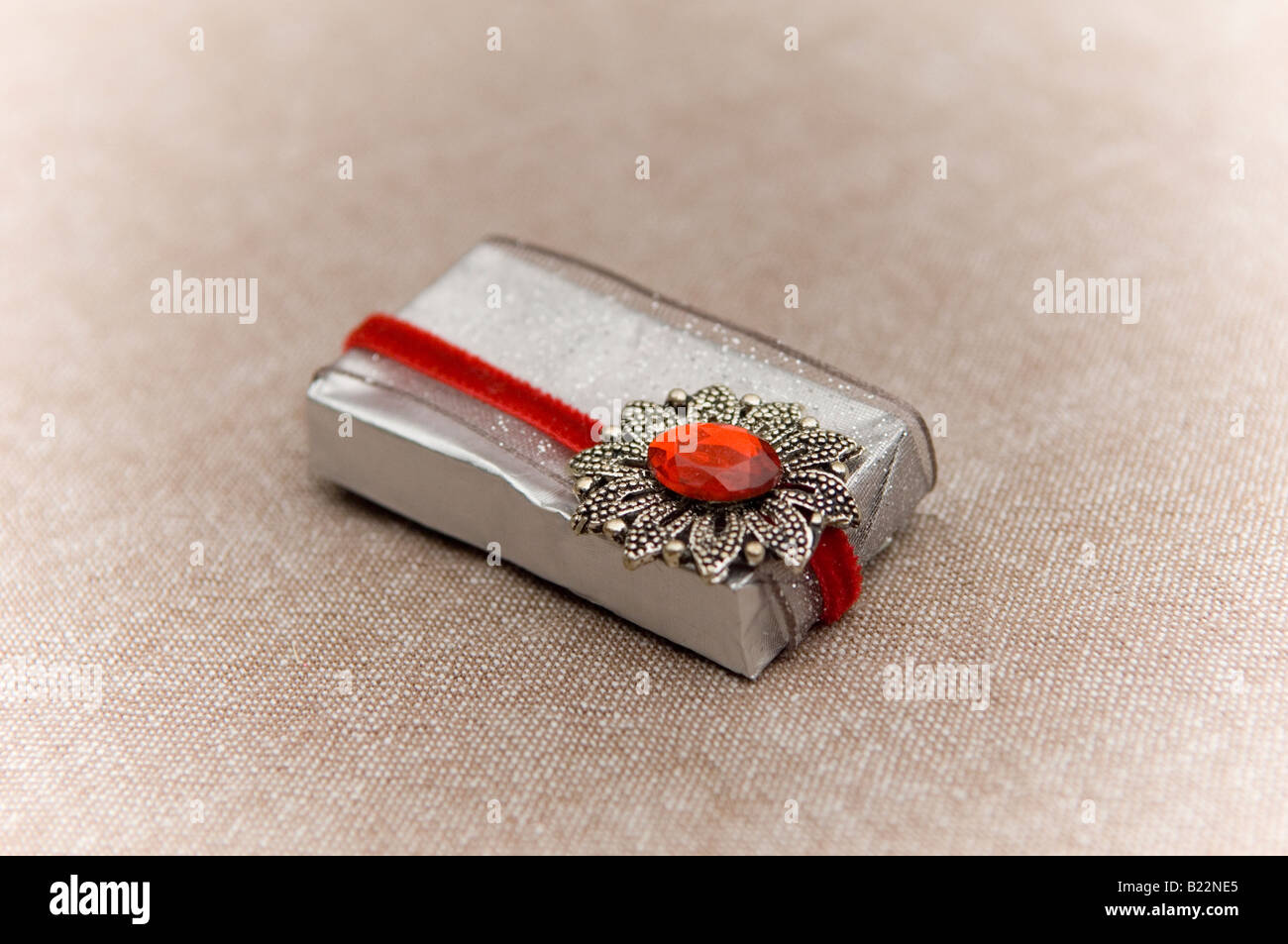 Chocolate wrapped in a silver design Stock Photo - Alamy