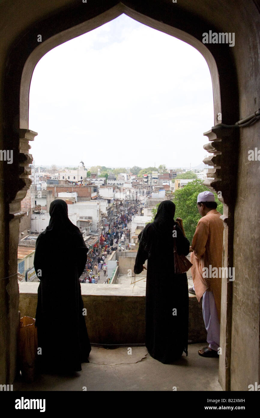 Muslims up in the Charminar in Hyderabad India look out onto the city ...