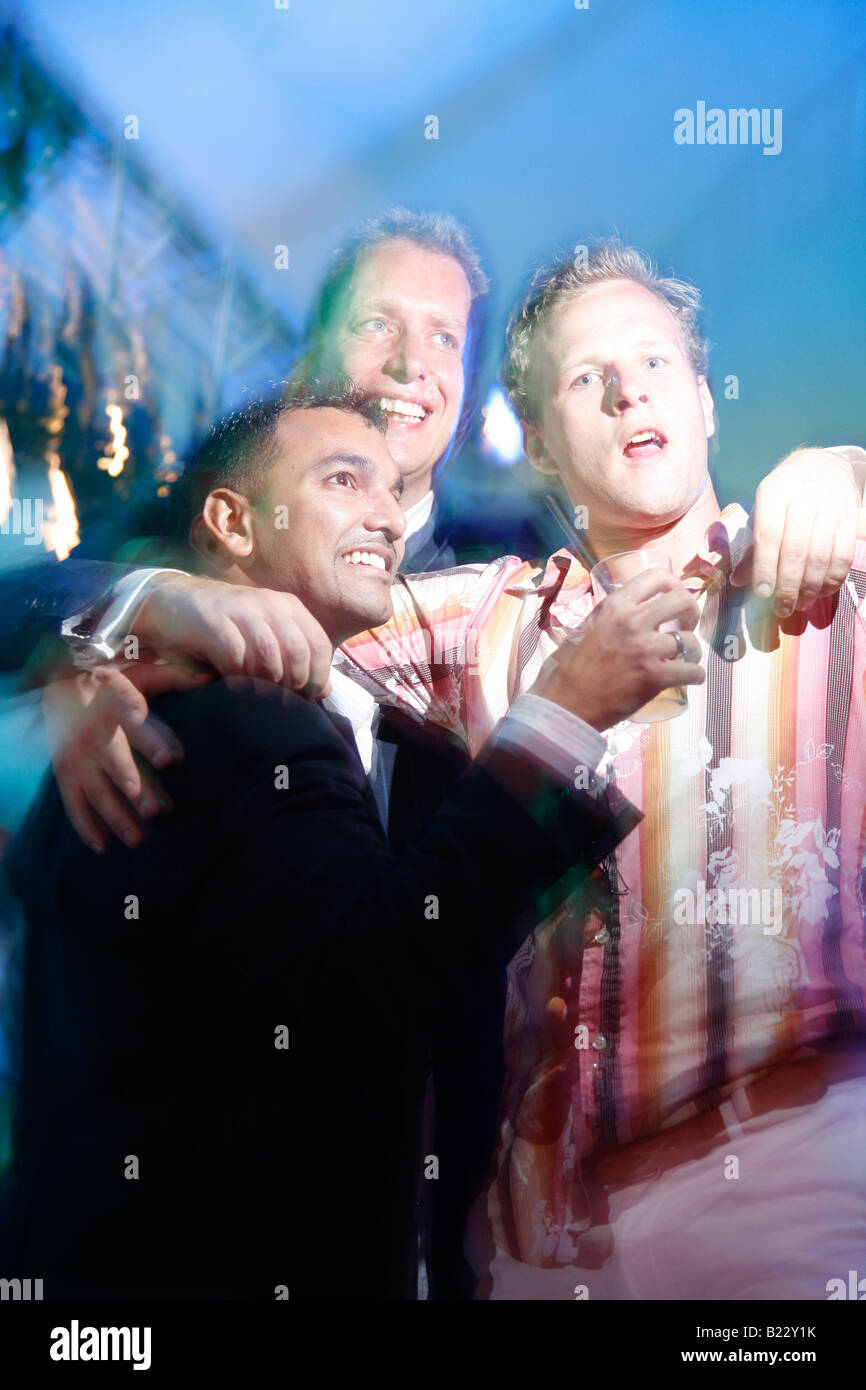 Three men in a nightclub party Stock Photo - Alamy