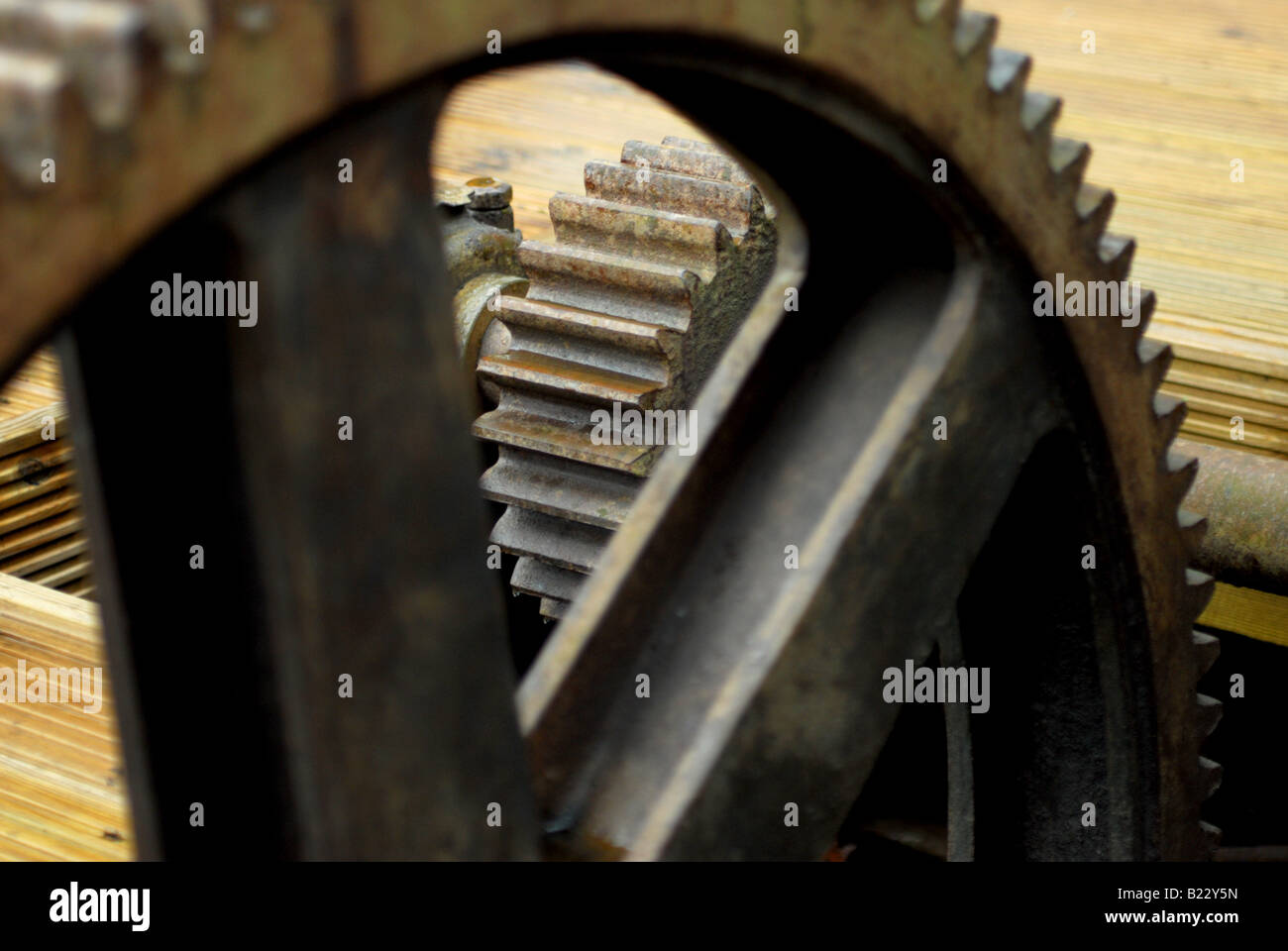 close up of gear wheels which work the mechanism of a water mill used ...