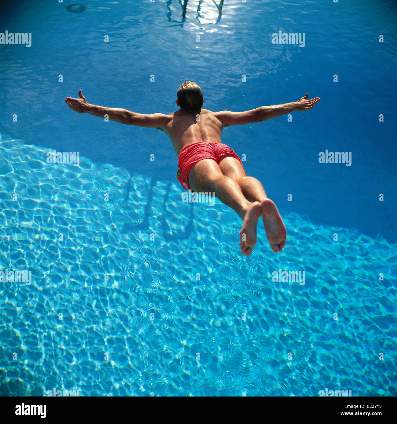 Person Diving Into Pool