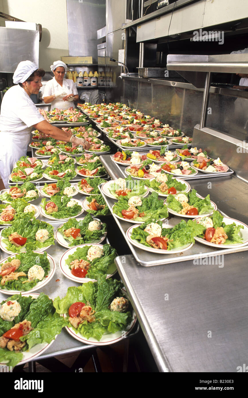 Female chefs preparing food in commercial kitchen Stock Photo - Alamy