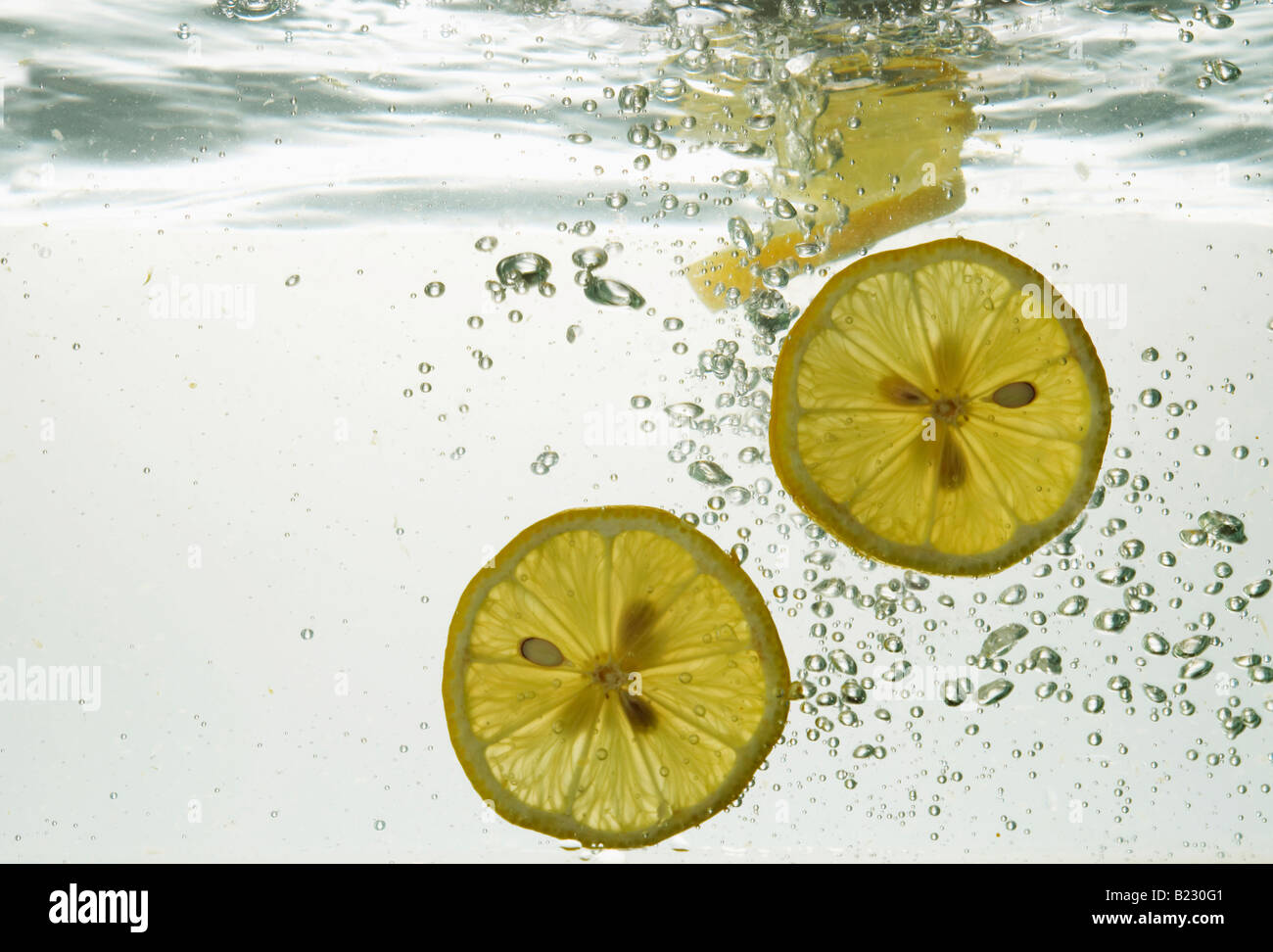 Movement fresh sliced lemon background hi-res stock photography and ...
