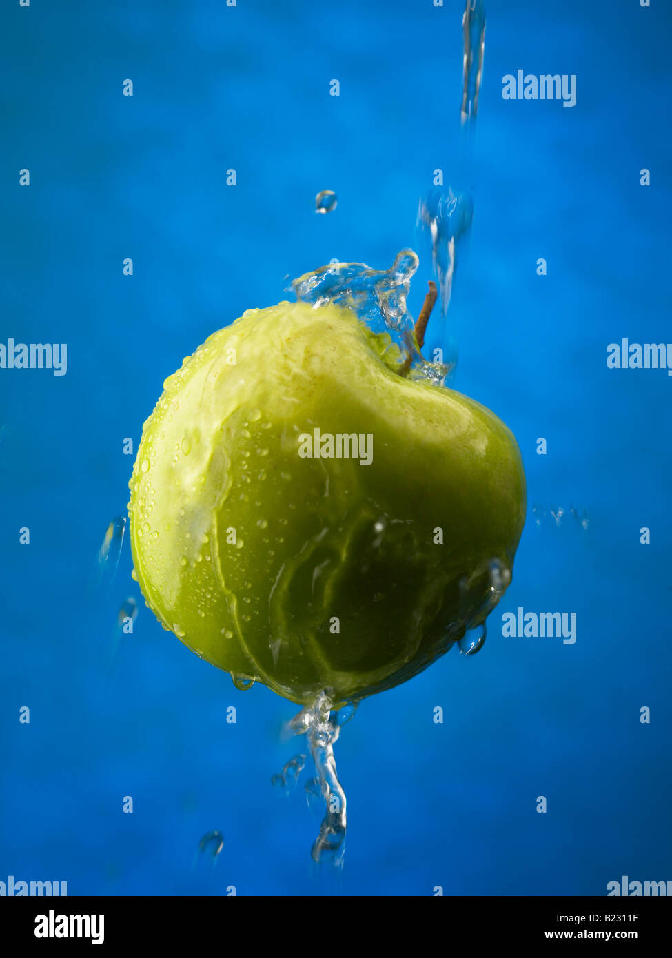 water pouring on green apple Stock Photo - Alamy