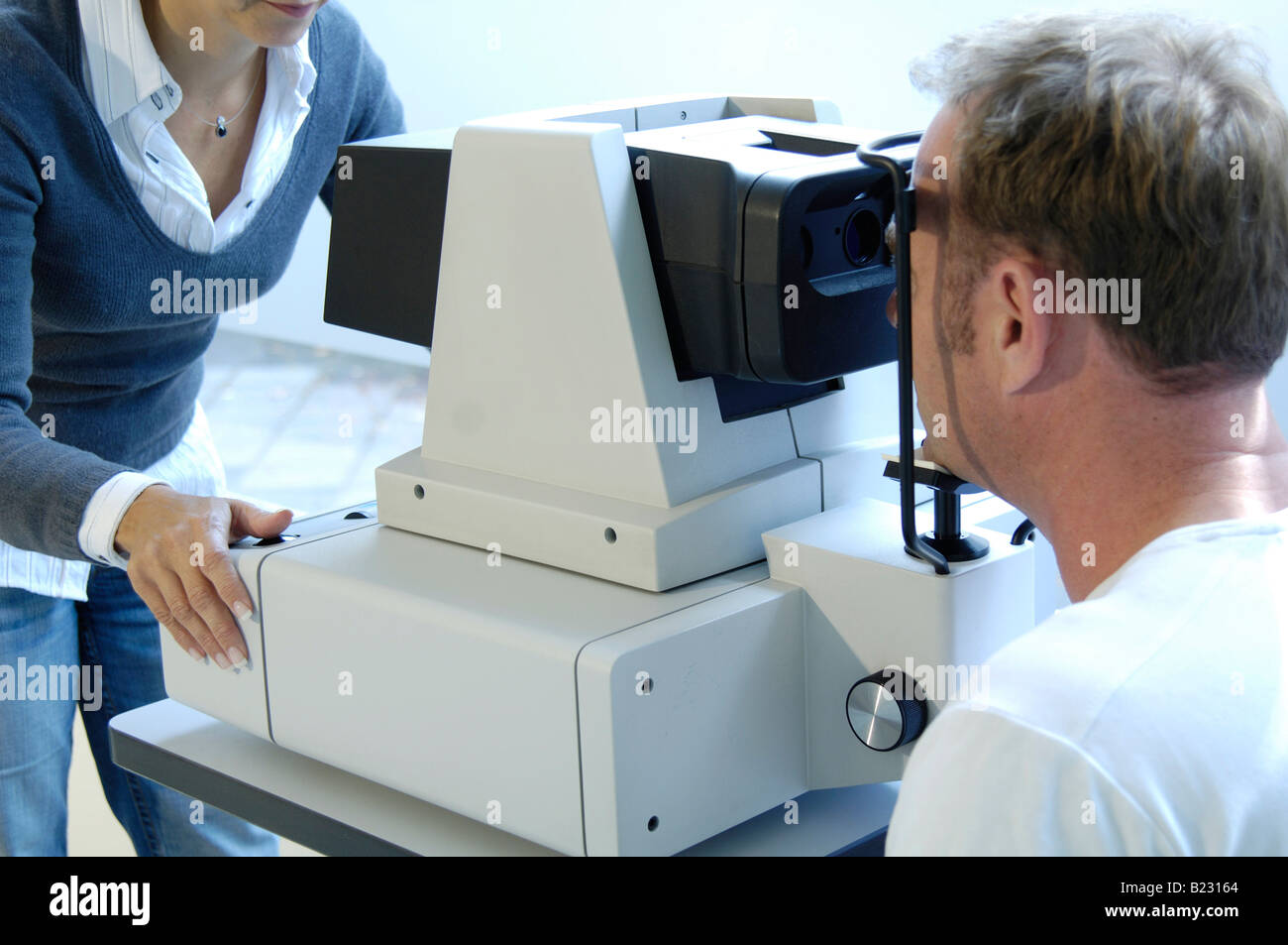 Close up optometrist examining patient hi-res stock photography and ...
