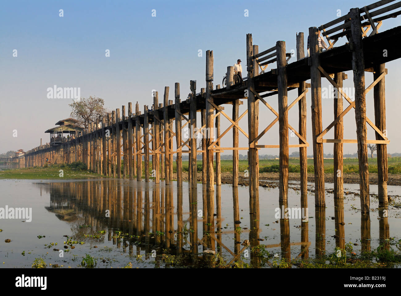 Wooden bridge across lake, U Bein Bridge, Taungthaman Lake, Amarapura ...