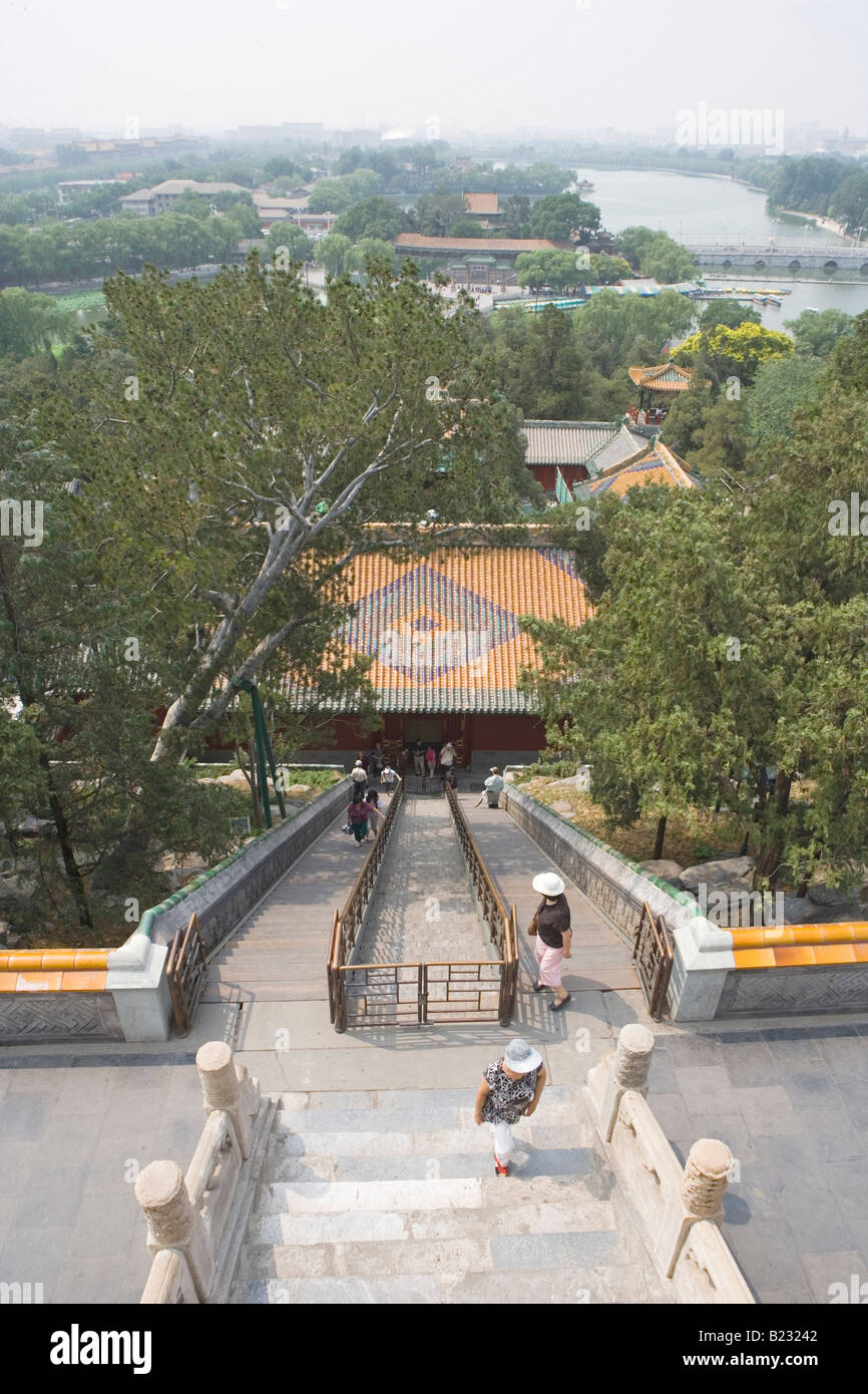 High angle view of tourists climbing stairs of pagoda White Dagoba ...