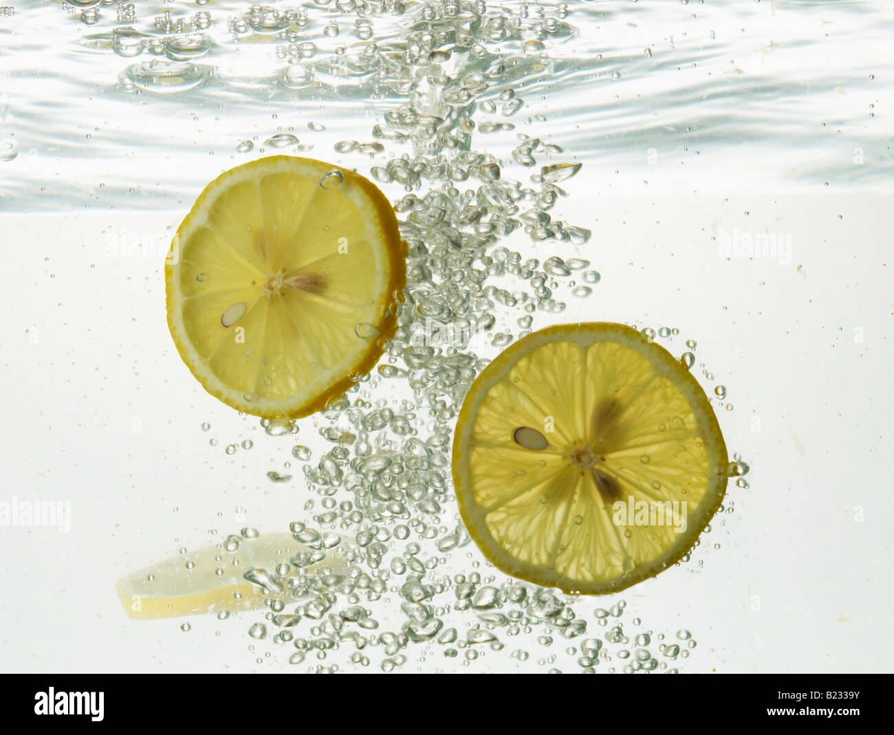 lemon slice splash Stock Photo - Alamy