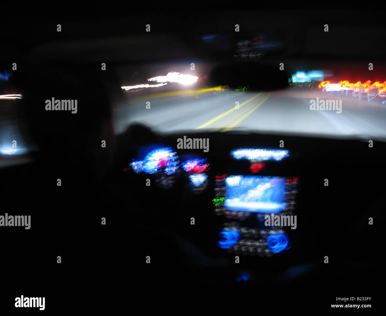 Driving at night in a modern luxury vehicle interior Stock Photo - Alamy