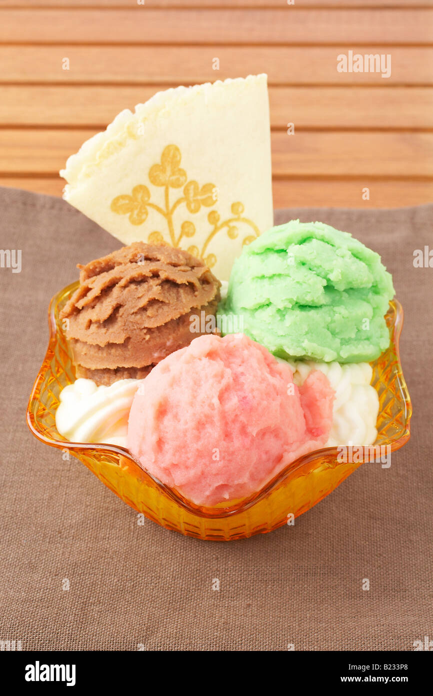 Delicious multi flavor ice cream on wood background Shallow depth of ...