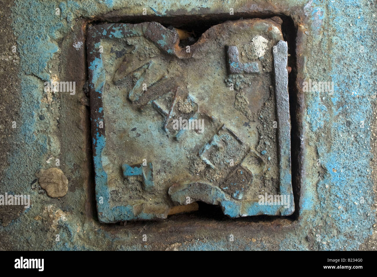 Close up of blue painted water valve cover on street Stock Photo - Alamy