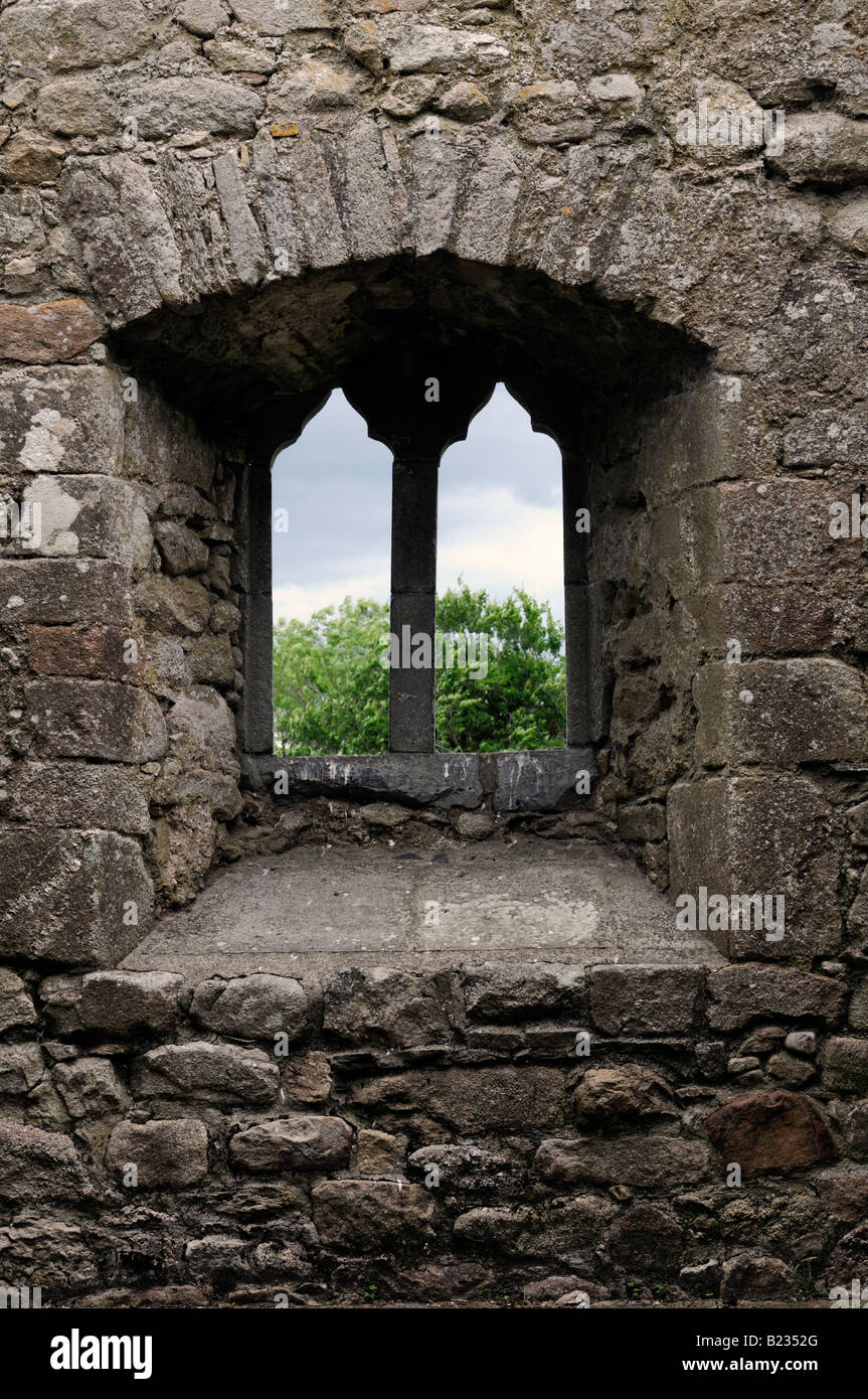 view through arched arch window ullard church stone wall Stock Photo ...