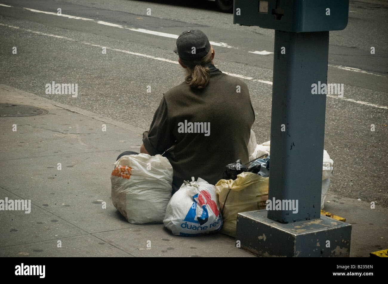 A homeless man on the street in Midtown Manhattan Stock Photo - Alamy